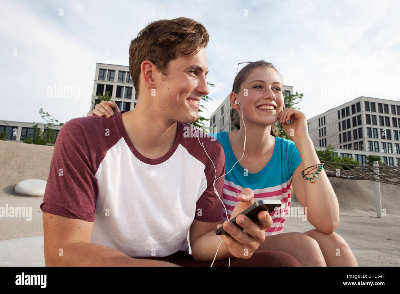 Germany, Bavaria, Munich, Couple listening to music Stock Photo - Alamy