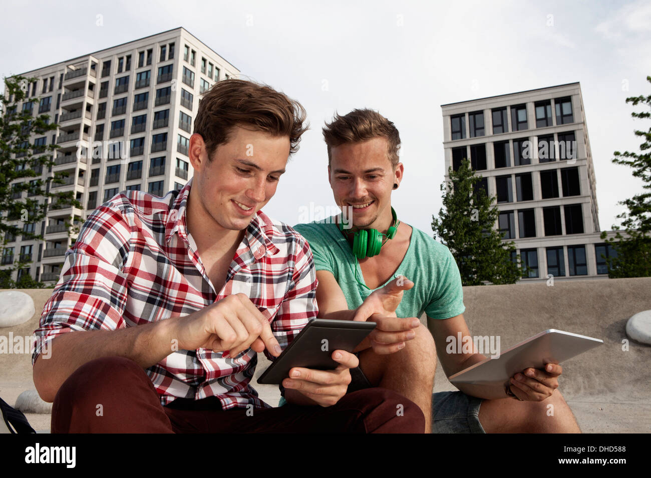 Germany, Bavaria, Munich, Friends with digital tablets outdoors Stock ...