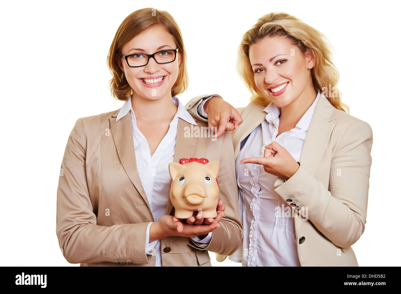 Two businesswomen holding piggy bank, smiling Stock Photo - Alamy