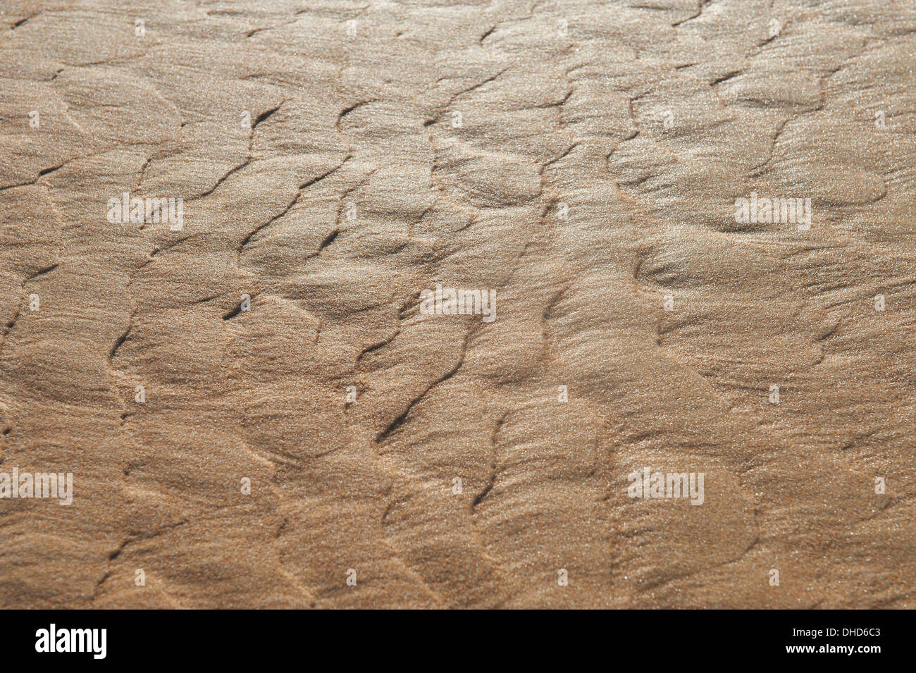 Sand Patterns on the beach left by the tide Stock Photo - Alamy