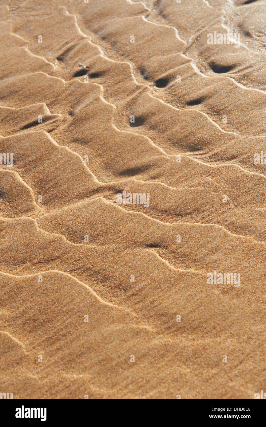 Sand Patterns on the beach left by the tide Stock Photo - Alamy