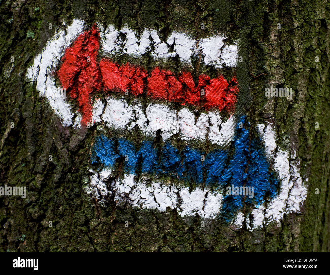 Mountain trail direction red and blue sign Stock Photo - Alamy