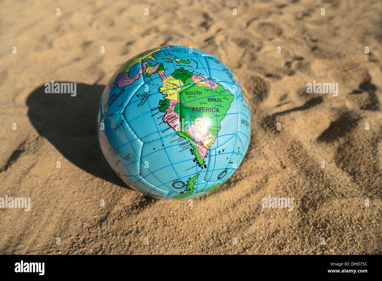 Soccer ball on sand Stock Photo - Alamy