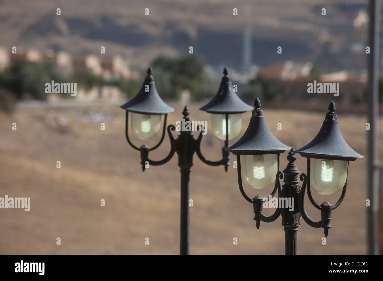 Lamppost with colored lightbulb Stock Photo - Alamy