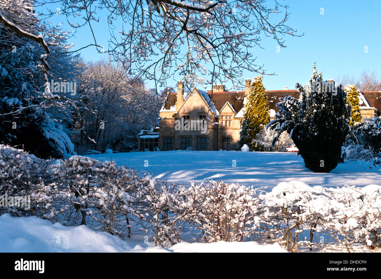 A country manor house set in a snow covered garden Stock Photo - Alamy