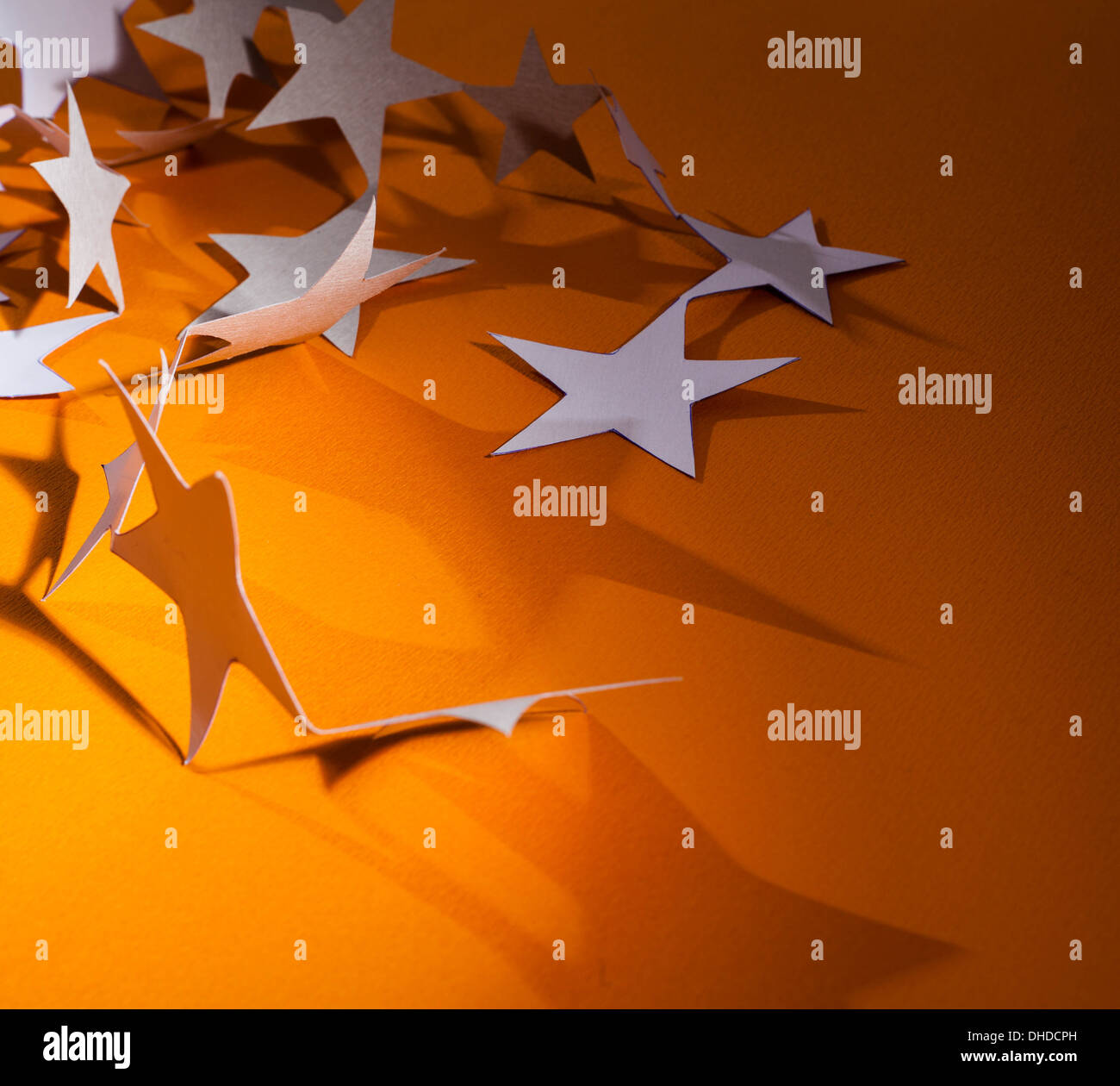 Paper stars group on a colour background Stock Photo - Alamy