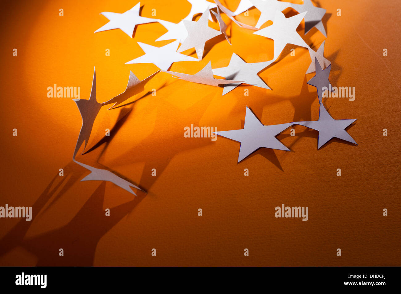 Paper stars group on a colour background Stock Photo - Alamy