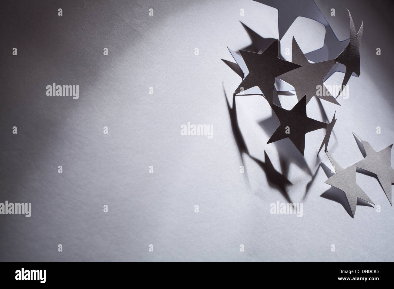 Paper stars group on a colour background Stock Photo - Alamy