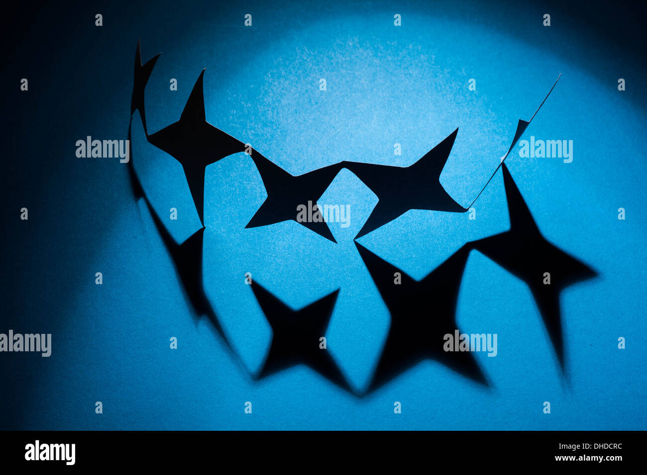 Paper stars group on a colour background Stock Photo - Alamy
