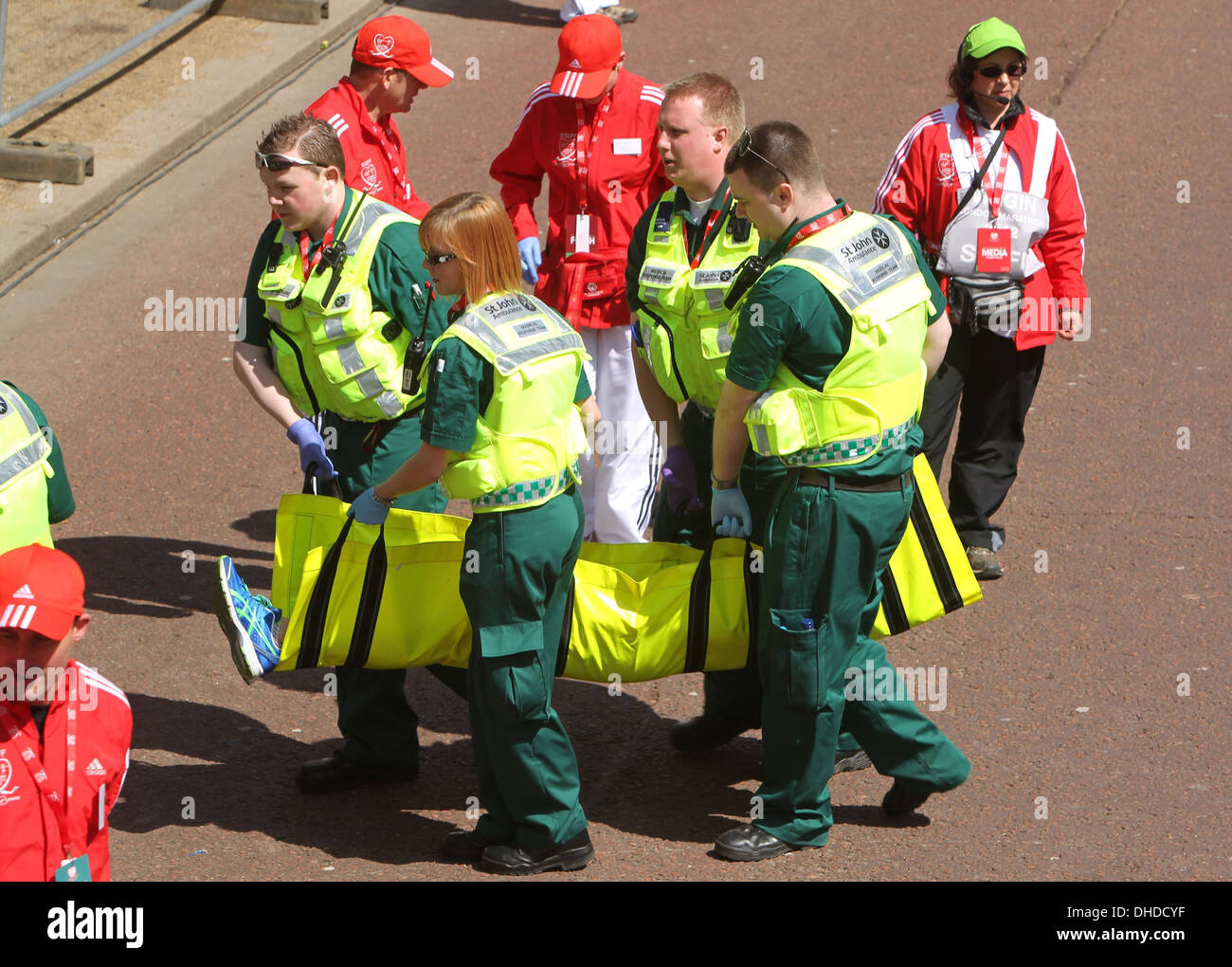A runner collapsed after running Marathon and is helped by ambulance ...