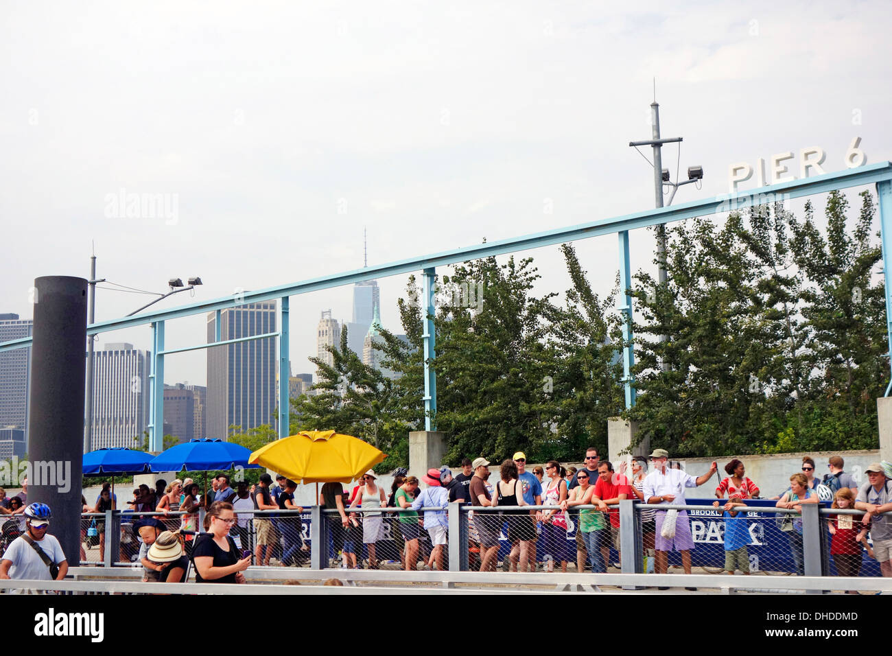 crowd waiting in line for ferry to Governors island Stock Photo - Alamy