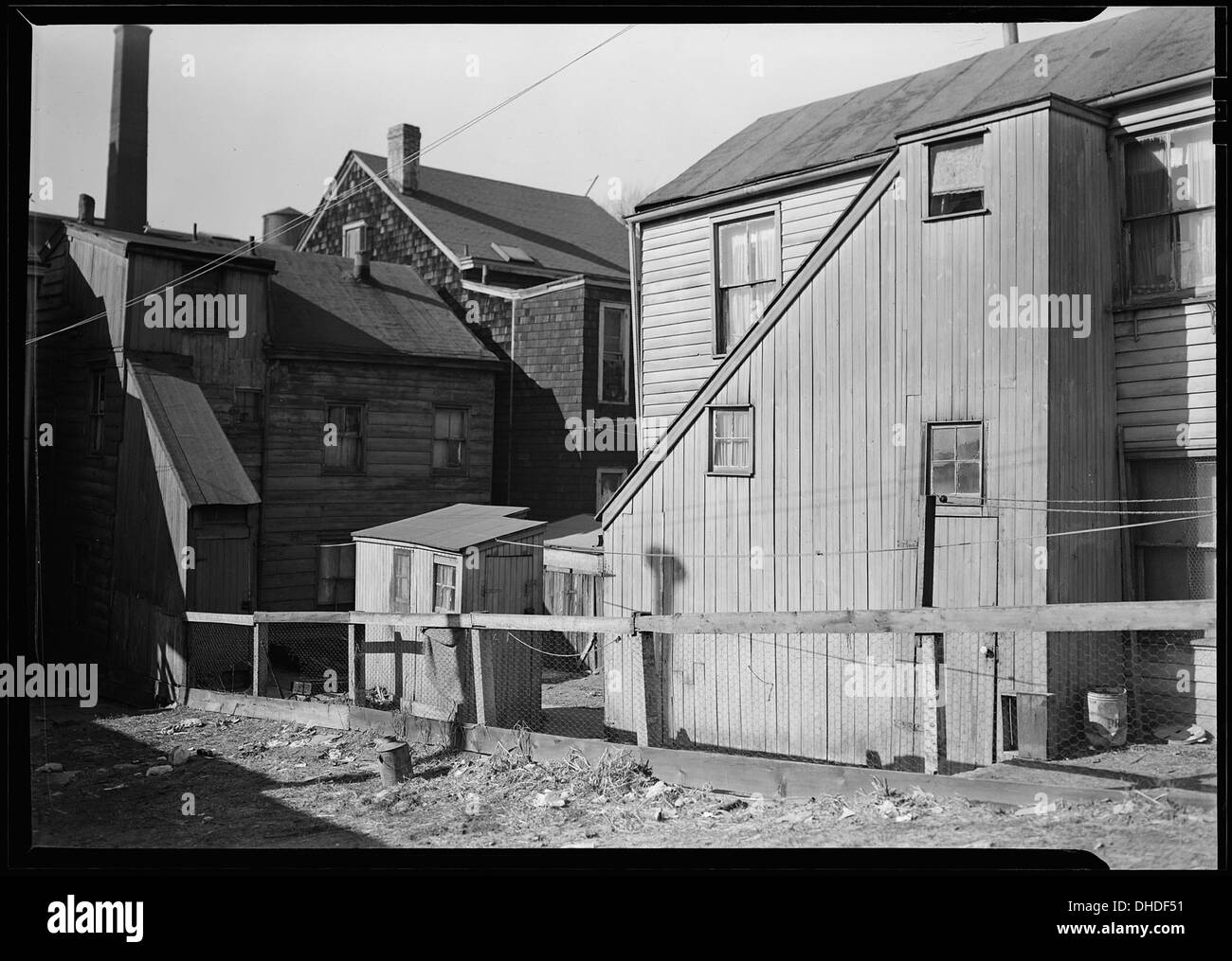 This photograph shows former silk workers living in a rear tenement off ...