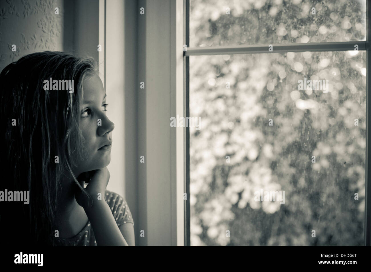 Sad Girl Looking Out Rainy Window