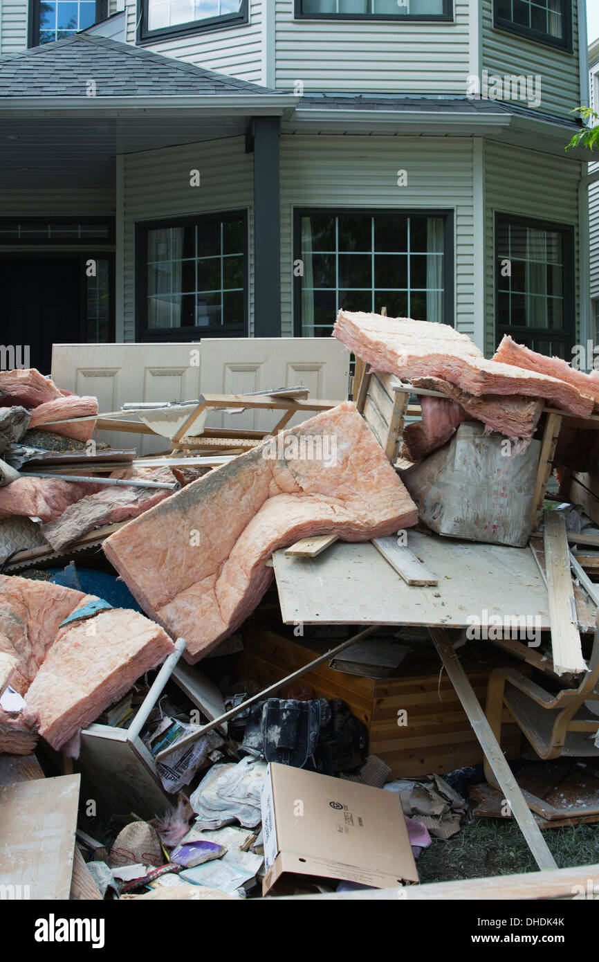 Garbage And Destroyed Household Items Piled Outside A Home After A ...