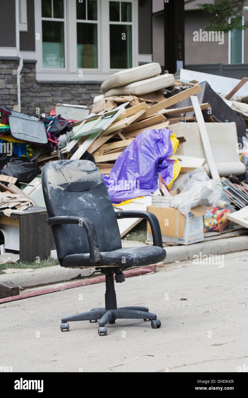 Garbage And Destroyed Household Items Piled Outside A Home After A ...