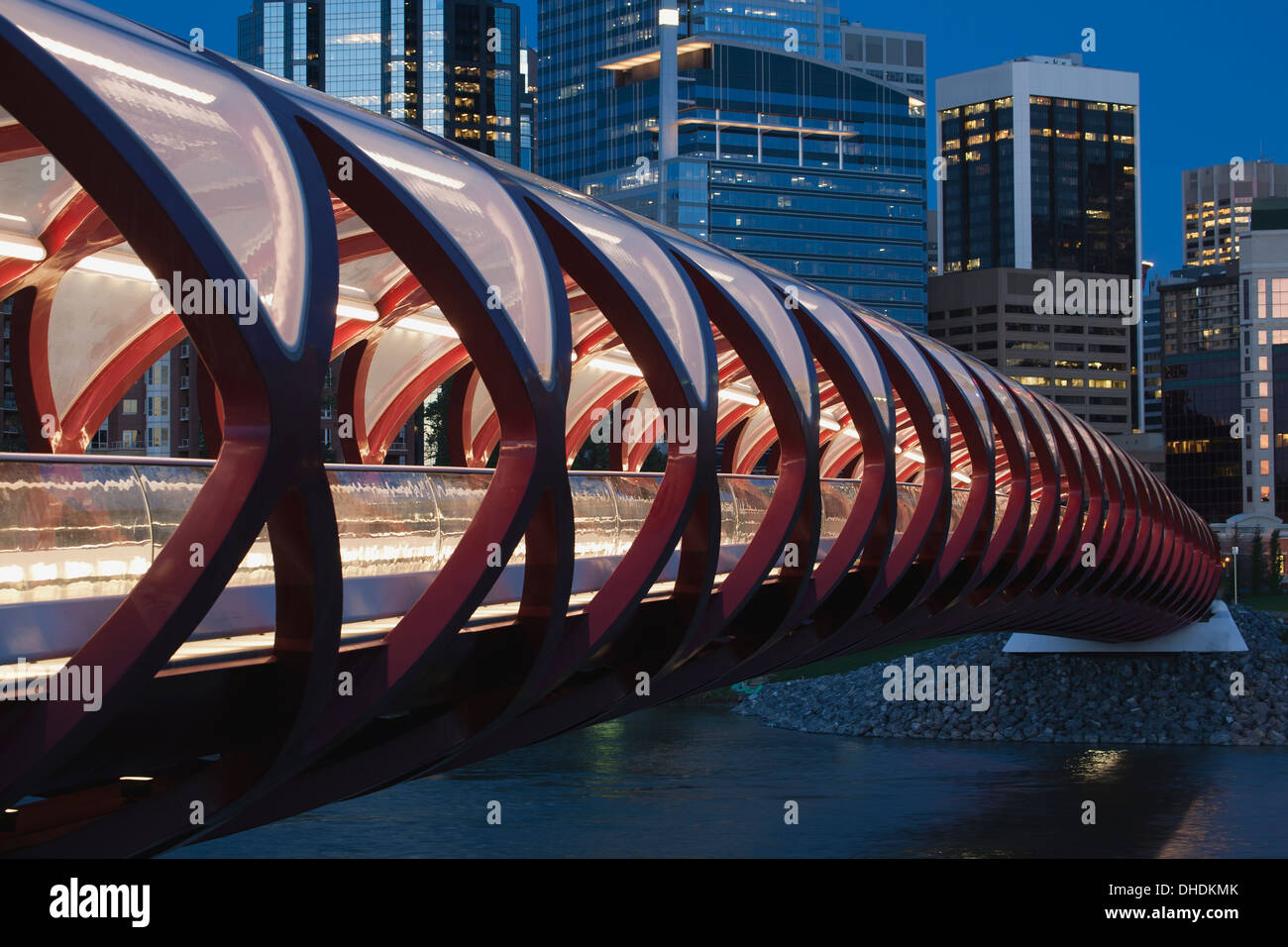 Red Bridge At Night With Lights And City Buildings In The Background ...