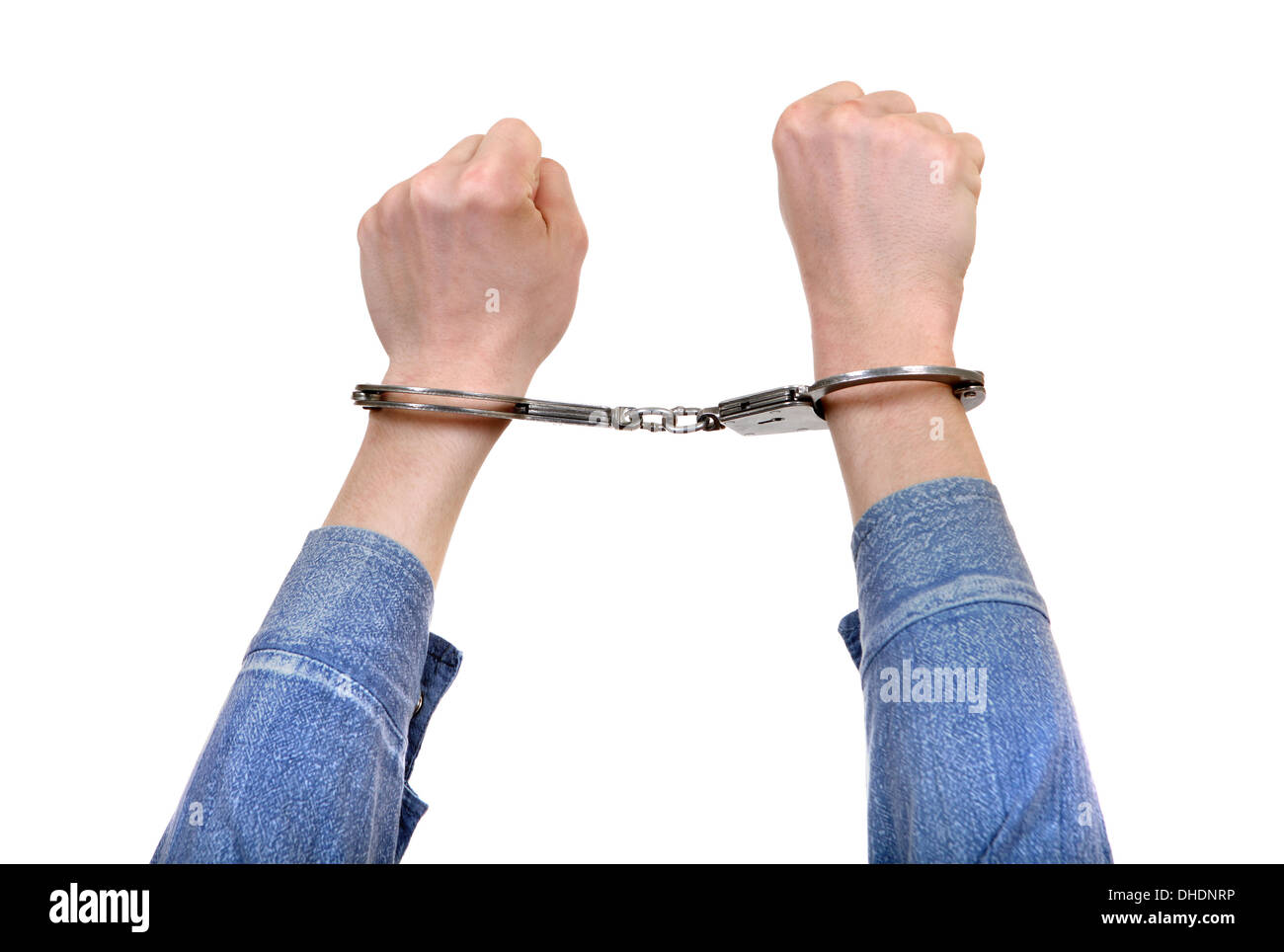 Handcuffs on hands hi-res stock photography and images - Alamy