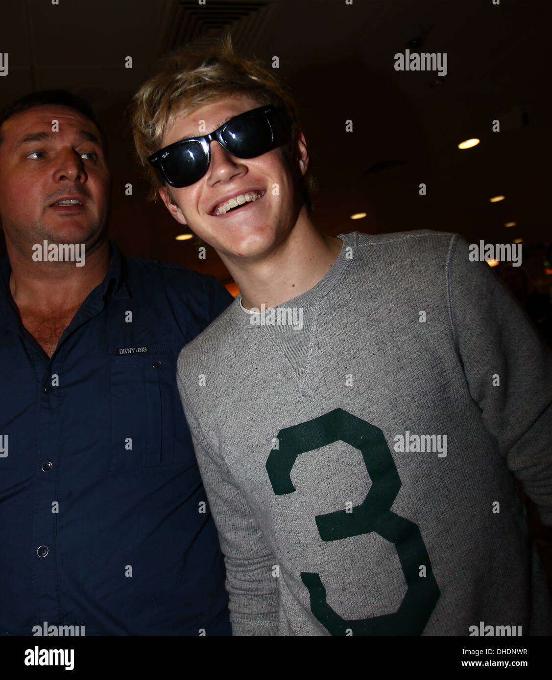 Niall Horan wearing braces One Direction arrive at Heathrow airport ...