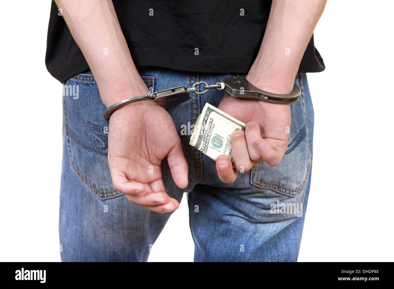 Handcuffs in Hands with Money Stock Photo - Alamy