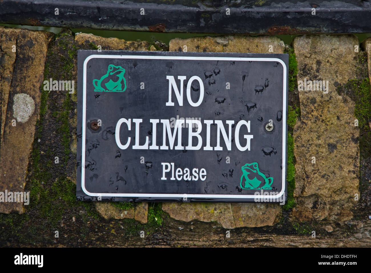 No Climbing sign with frog motifs Stock Photo - Alamy
