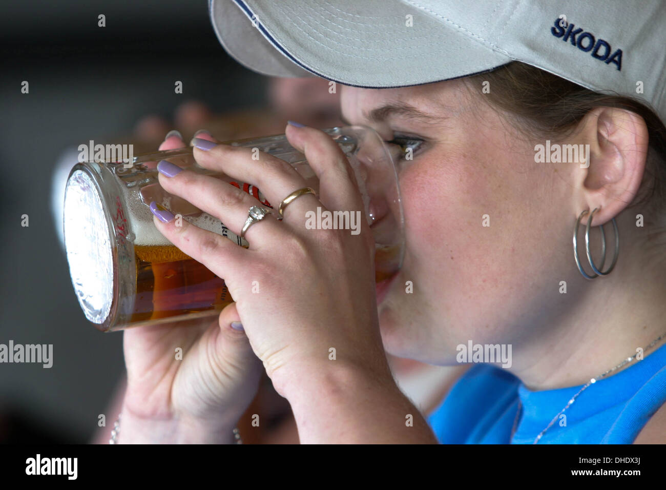 Woman drinks beer, competition in speed drinking, beer festival Czech ...
