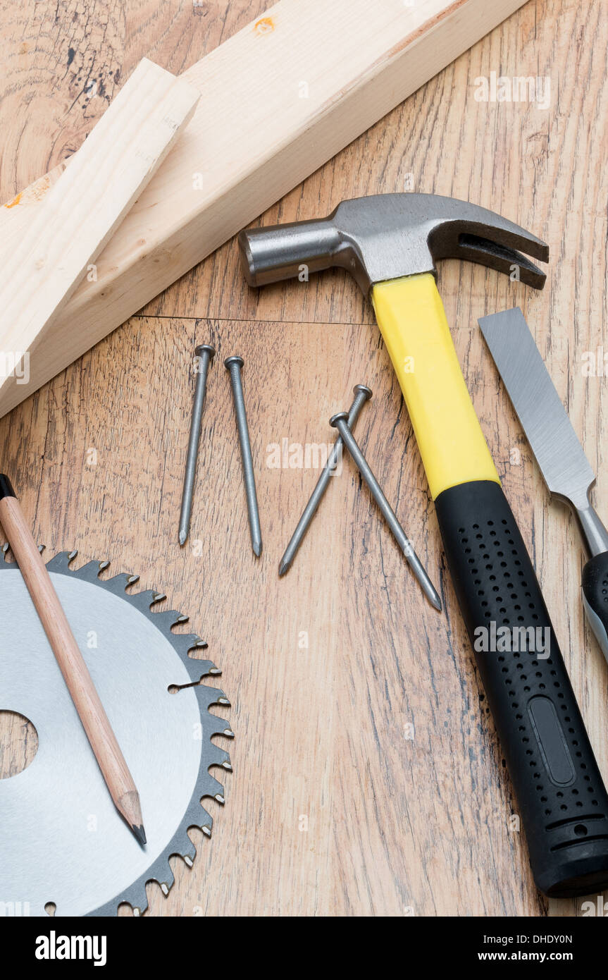 A selection of woodworking and carpentry tools placed on a wood ...