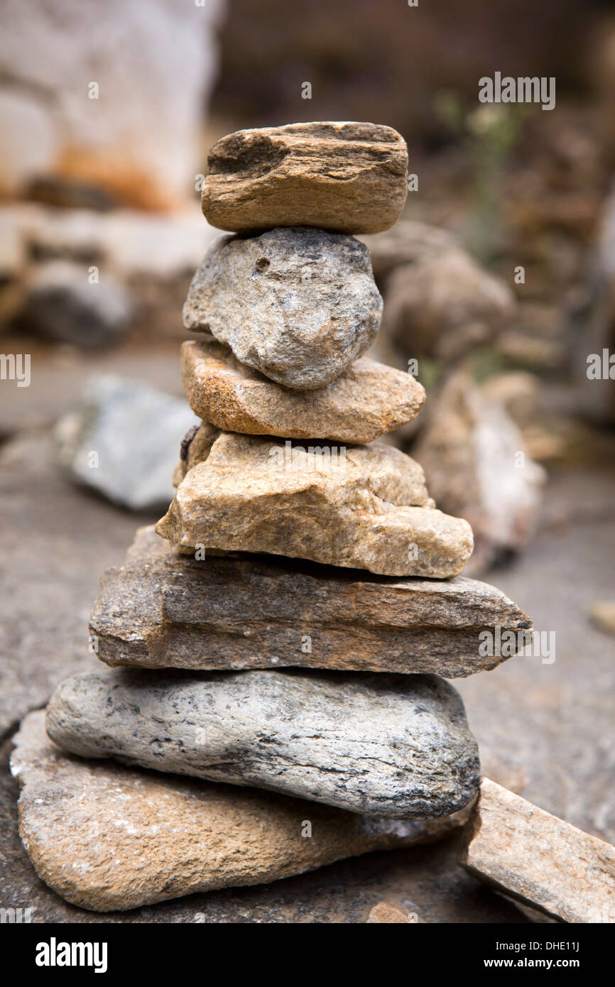 Bhutan, Paro Valley, Tachog Lhakang Dzong, pile of stone offerings to ...