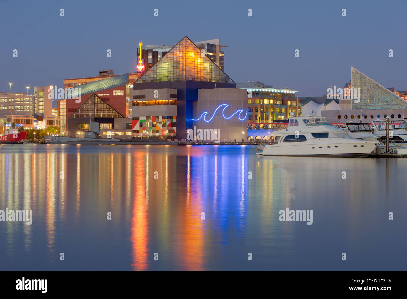 Lights from the National Aquarium reflect off the waters of the Inner ...