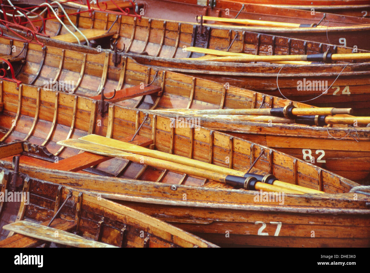 Traditional wooden rowing boats moored together at Stratford-Upon-Avon ...