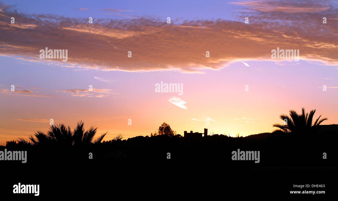 Sunset over Palma de Majorca west hills and its medieval castle, Spain ...