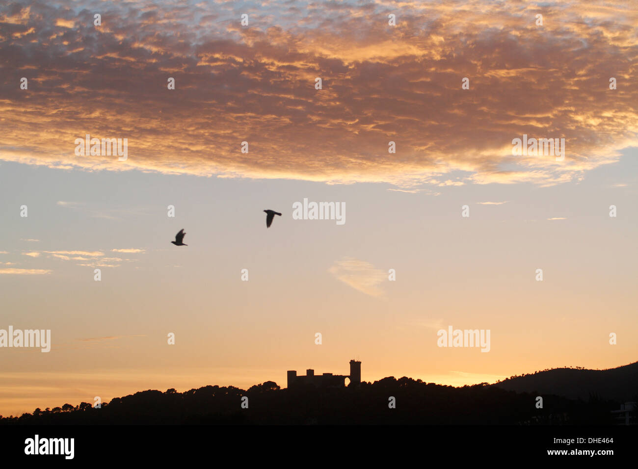 Sunset over Palma de Majorca west hills and its medieval castle, Spain ...