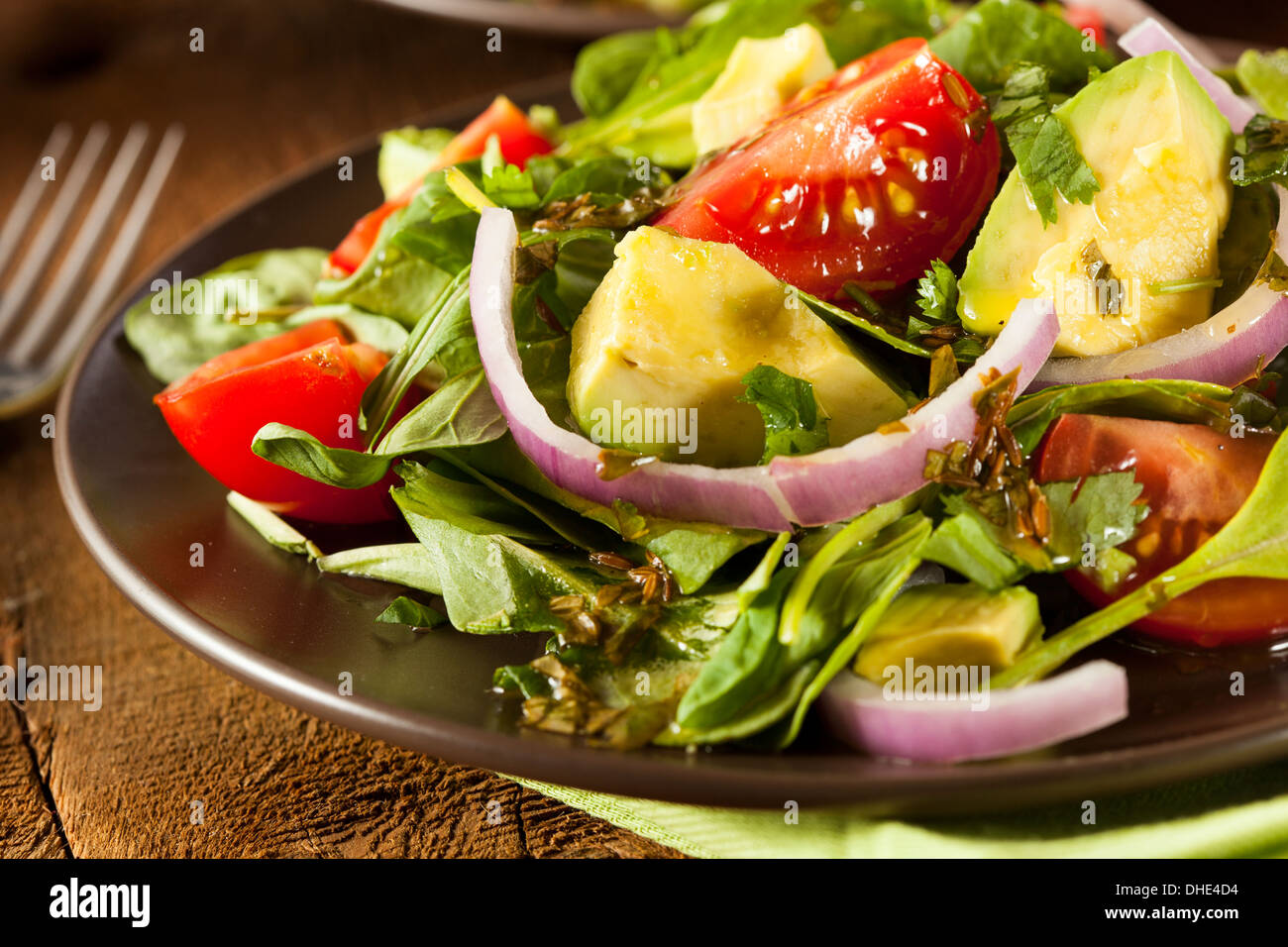 Organic Green Avacado and Tomato Salad with Onions Stock Photo - Alamy
