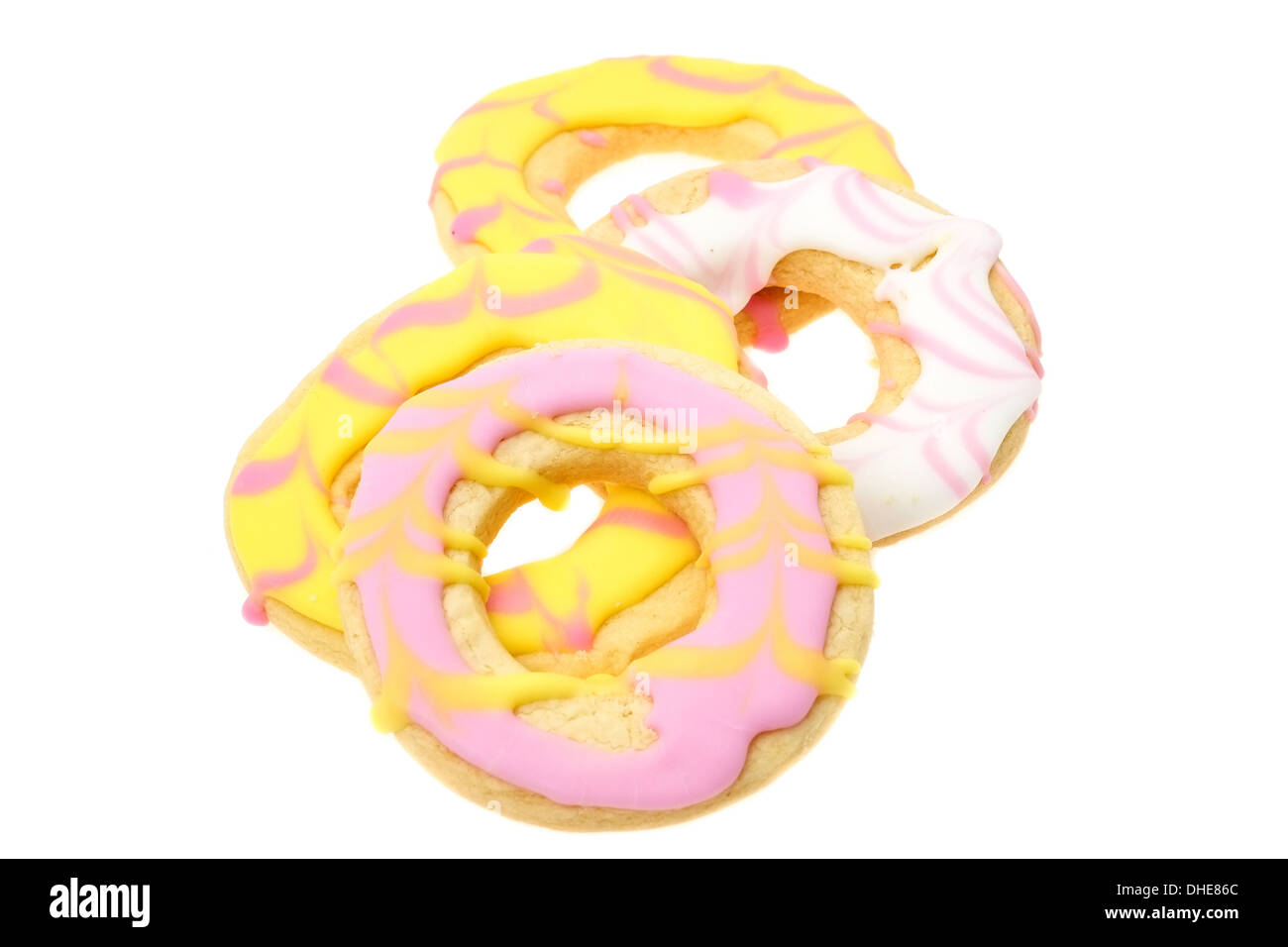 An assortment of ring shortbread cookies that have been coated in ...