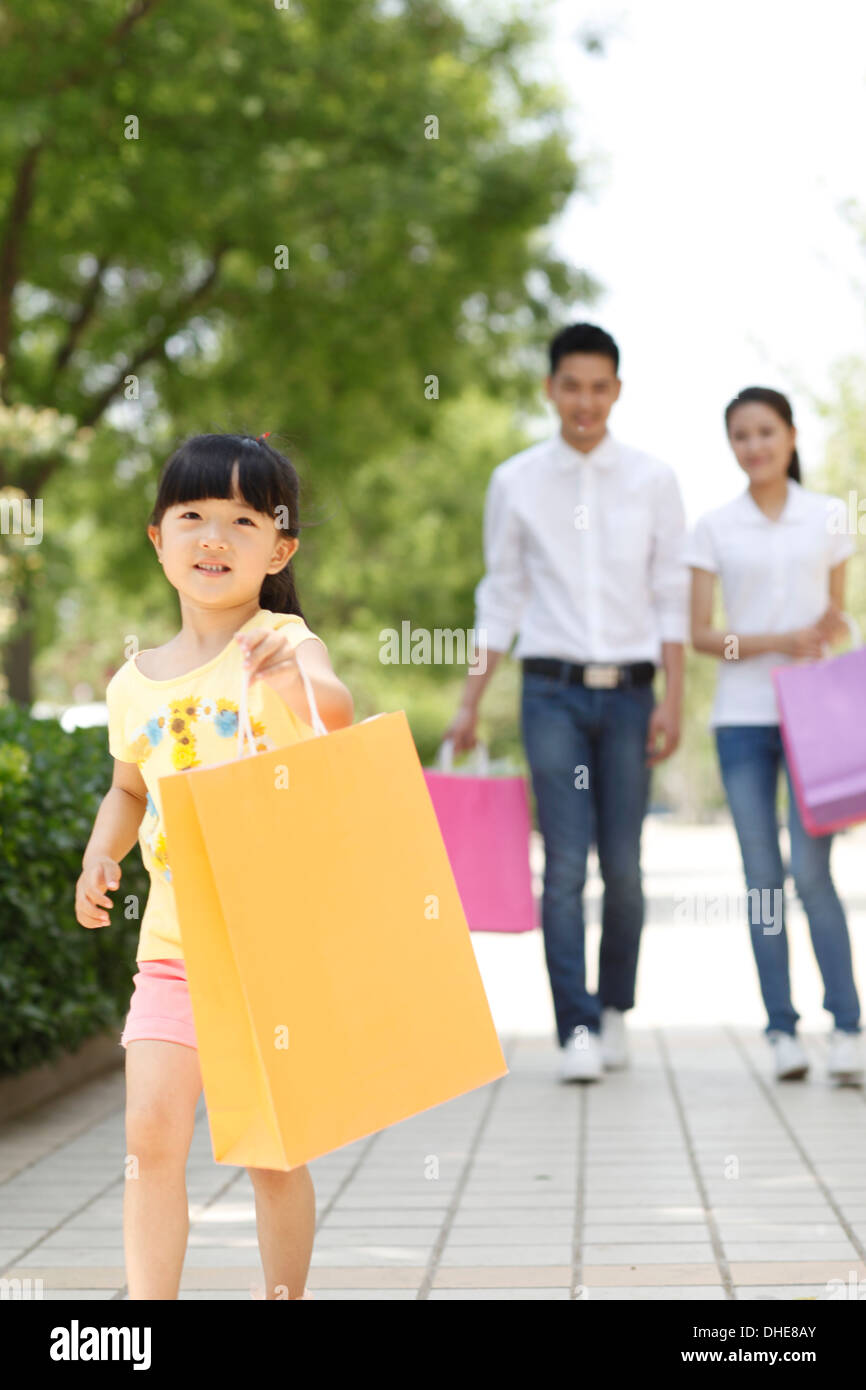 A family of three to go shopping happy Stock Photo - Alamy