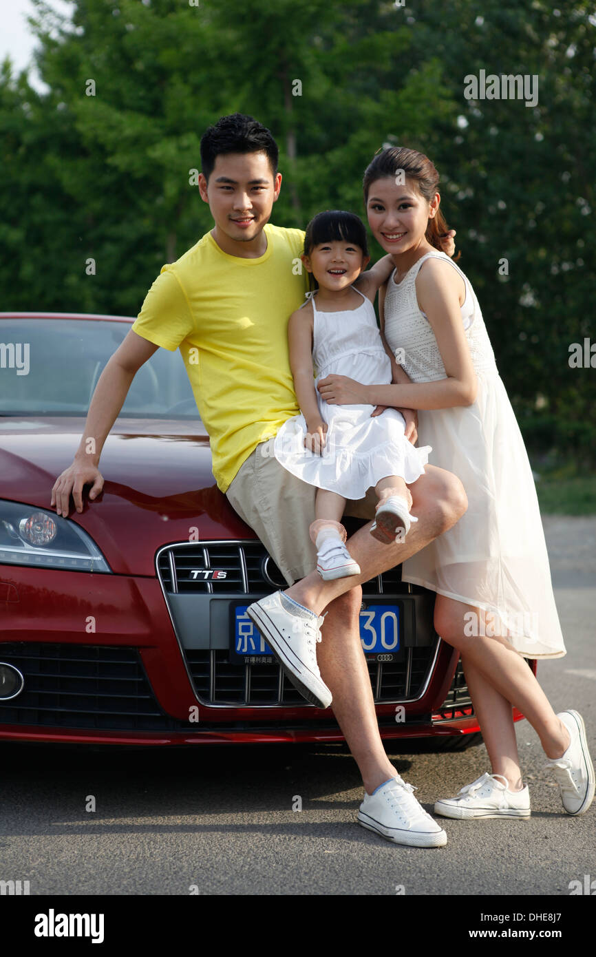 A happy family of three driving convertible cars Stock Photo - Alamy