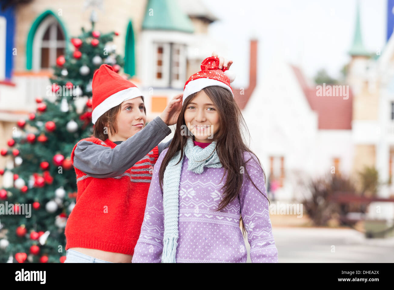 Putting on hat child hi-res stock photography and images - Alamy