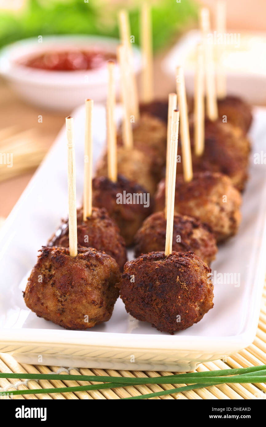 Meatball appetizers with toothpicks (Selective Focus, Focus on the ...