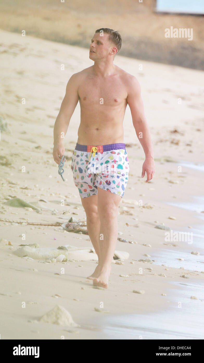 Jeff Brazier takes a walk along a beach and prepares to go for a swim ...