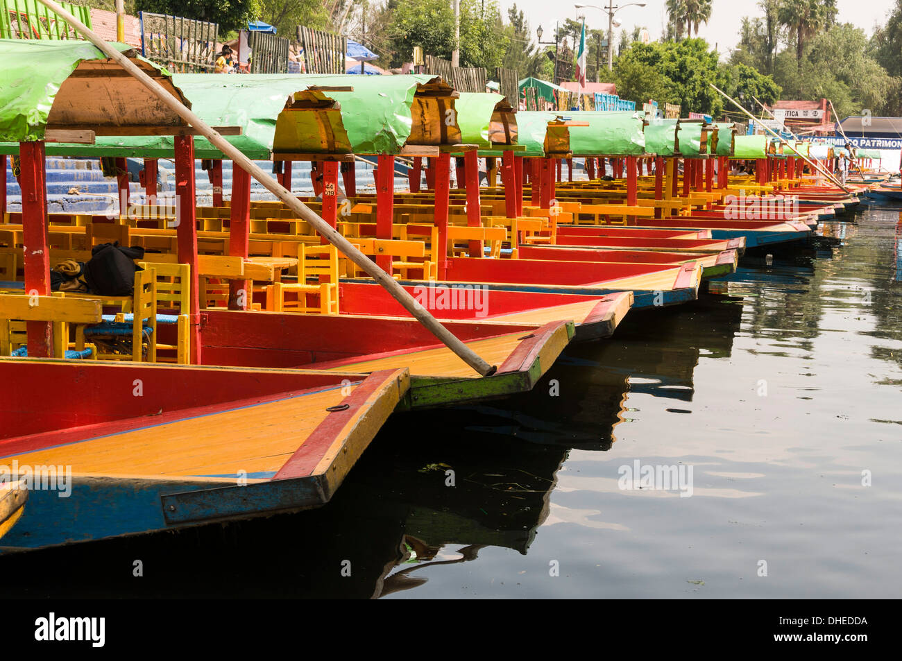 Line of colourful boats at the Floating Gardens in Xochimilco, UNESCO ...