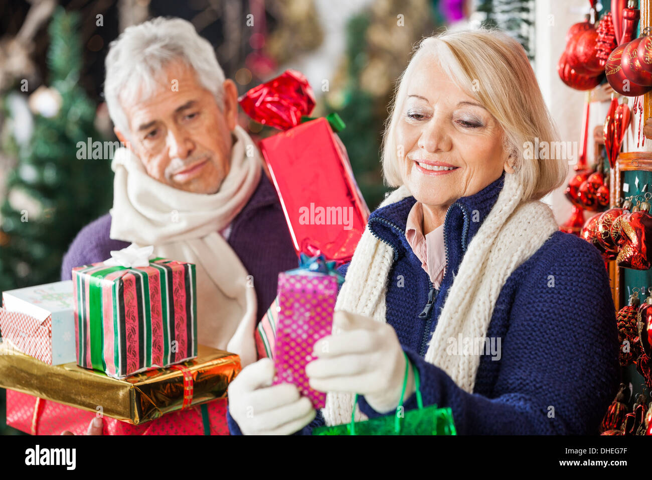 Woman Buying Presents With Man In Store Stock Photo - Alamy