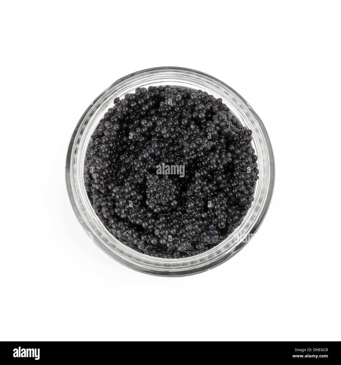 Black caviar in a glass jar. Top view isolated on white background ...