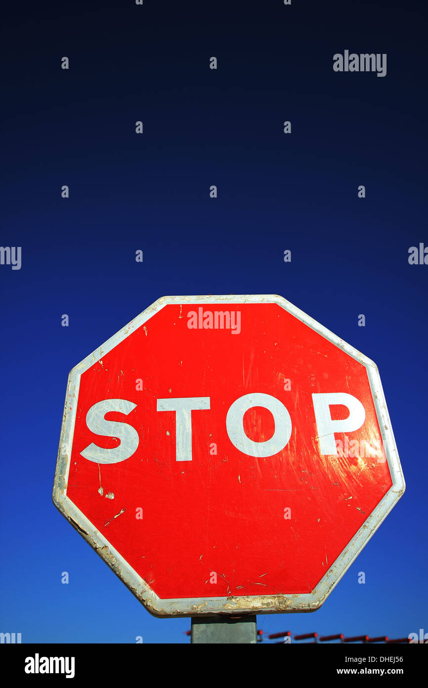 Red Stop Sign with blue background Stock Photo - Alamy