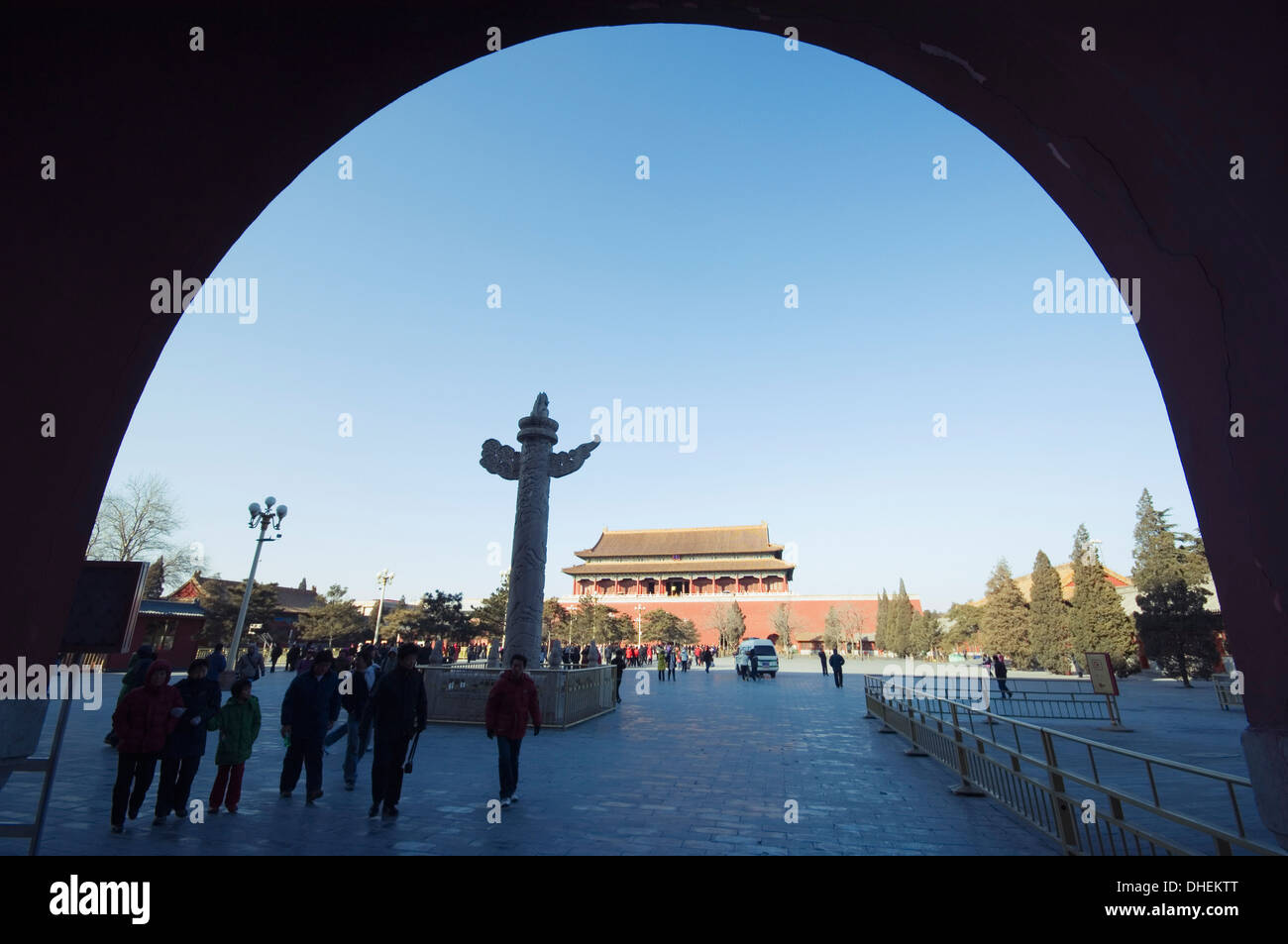 a Huabiao statue under an arch of the Gate of Heavenly Peace between ...