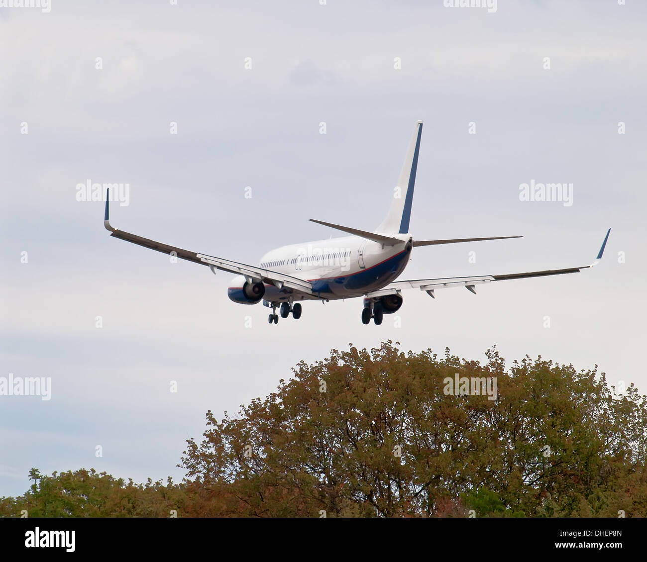 photograph of landing airplane - back view Stock Photo - Alamy
