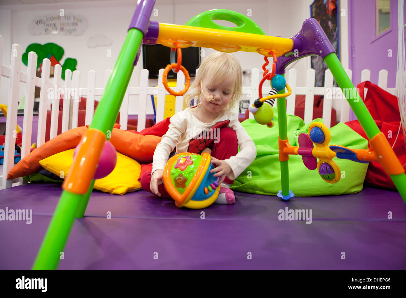 A young girl enjoys the playroom at a hospital UK Stock Photo - Alamy