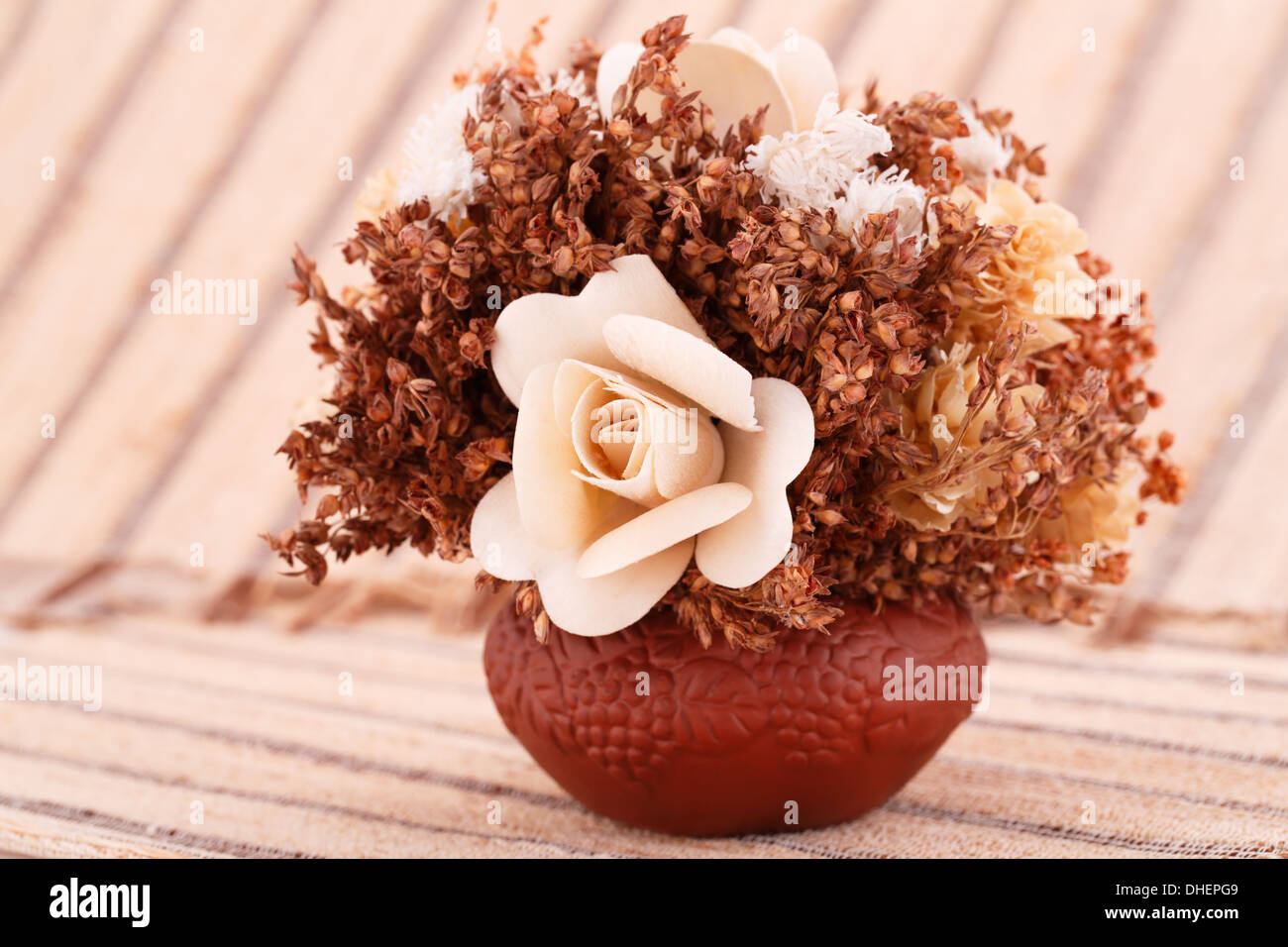 Flowers in vase isolated on bamboo mat background Stock Photo - Alamy