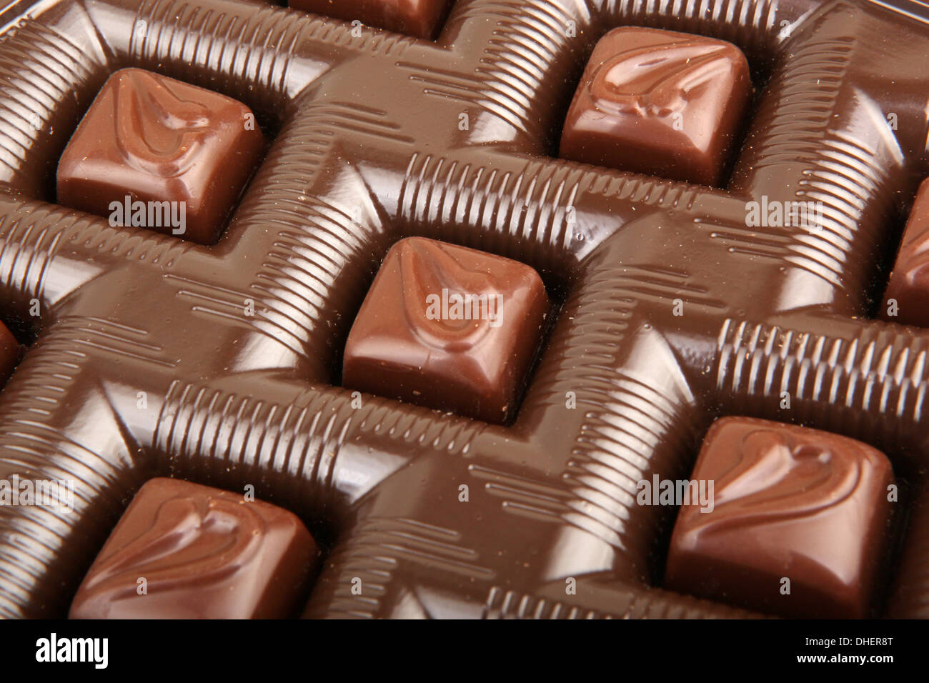 stacked chocolate candy on white background Stock Photo - Alamy