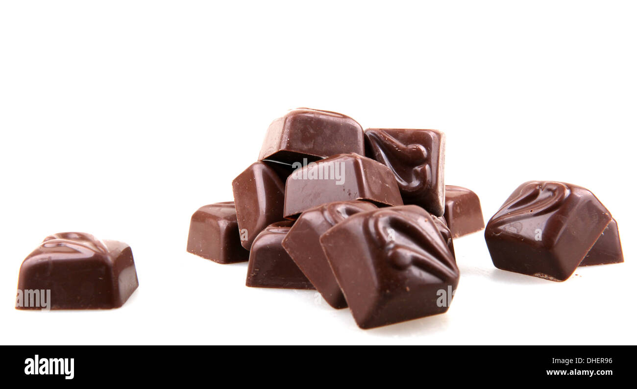 stacked chocolate candy on white background Stock Photo - Alamy