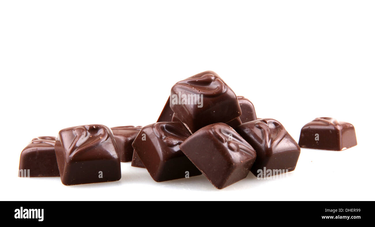 stacked chocolate candy on white background Stock Photo - Alamy