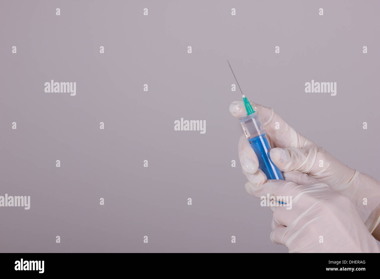 medical syringe and needle in hands in medical gloves Stock Photo - Alamy